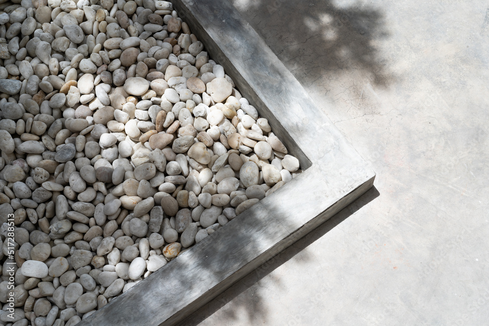 White pebble stone texture on the ground. The pebbles closely stone ...