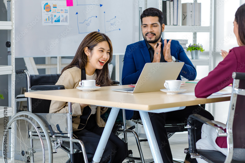 Millennial Indian male businessman manager mentor in formal suit talking helping disabled ...