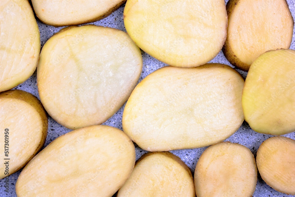 Natural sliced potatoes background.Ripe natural organic potatoes ...