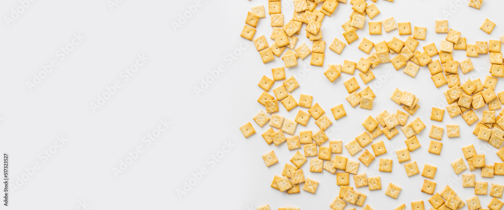 Crispy square shaped cracker scattered on white background. Top view ...