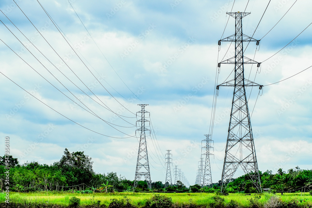 High-voltage transmission towers, complex steel structures in rural ...