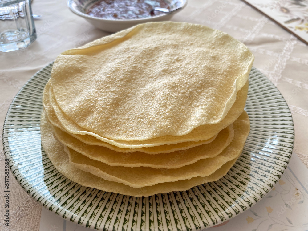 Stack of poppadoms. Stock Photo | Adobe Stock