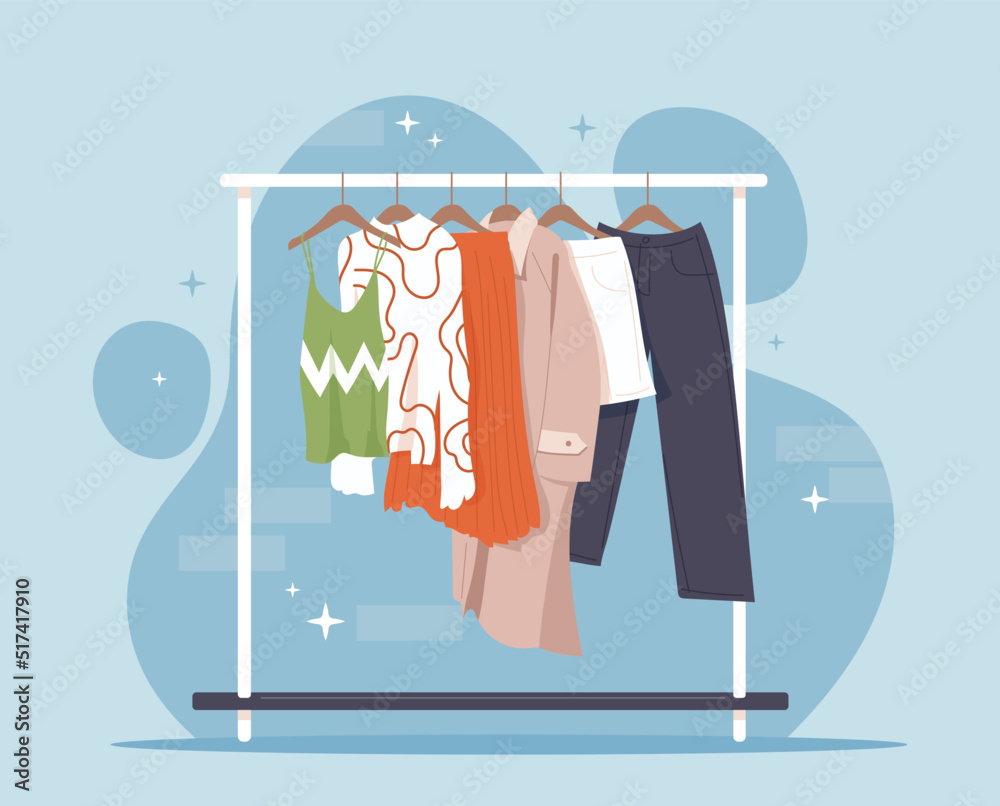 Fashion clothing on hangers. Stylish trousers, coat and shirt in ...
