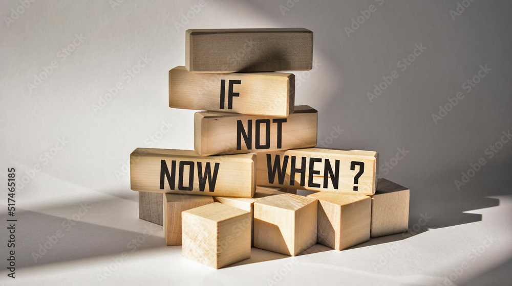 If not now then when symbol on wooden blocks and white background. Copy ...
