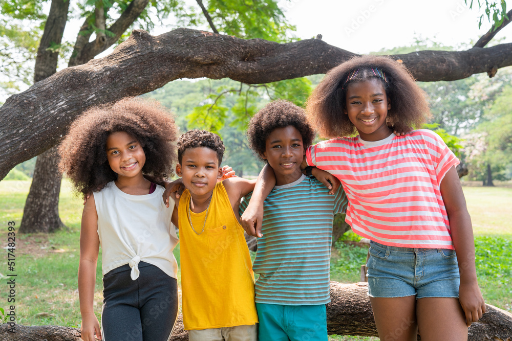 Foto de Portrait of happy African American children standing and ...