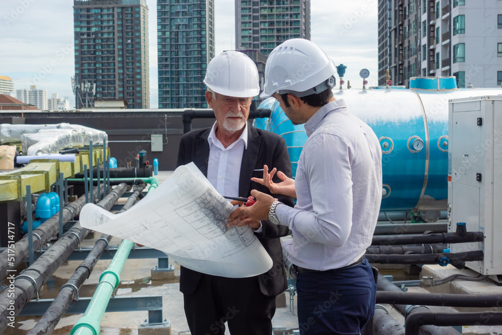 Engineer under checking the industry chilled water fan coil unit air ...