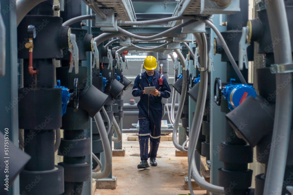 Engineer under checking the industry chilled water fan coil unit air ...