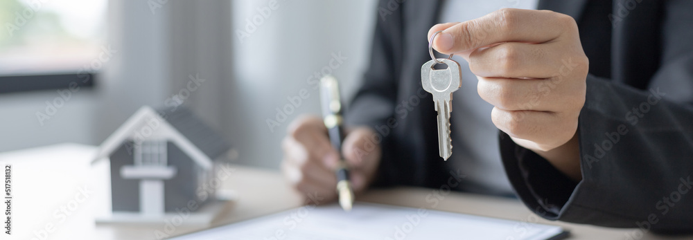 Sales manager or salesperson holds a demo house and has a home purchase ...