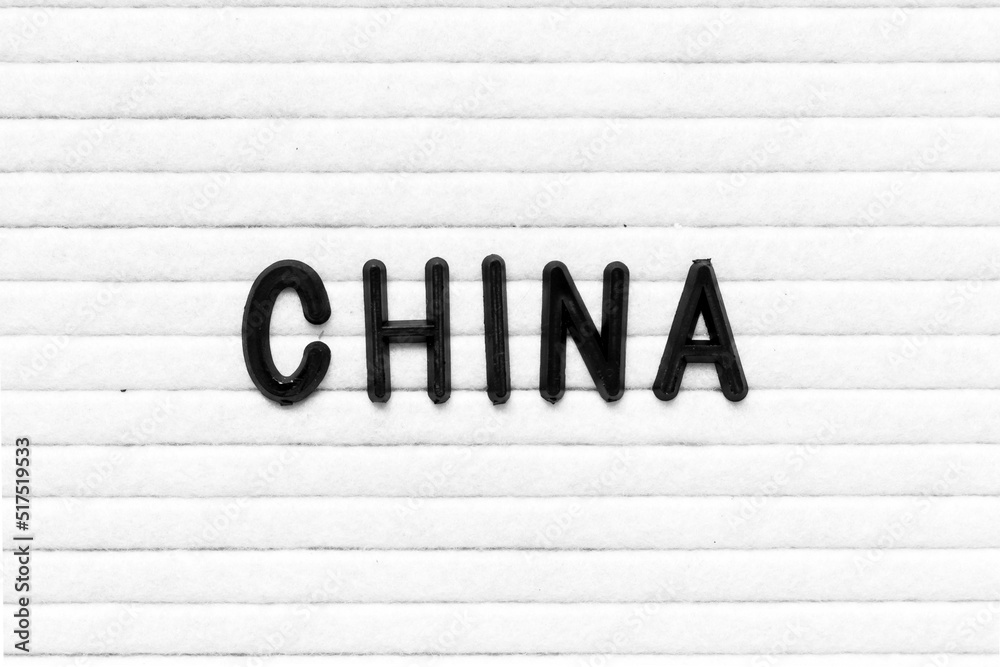Black color letter in word china on white felt board background Stock ...