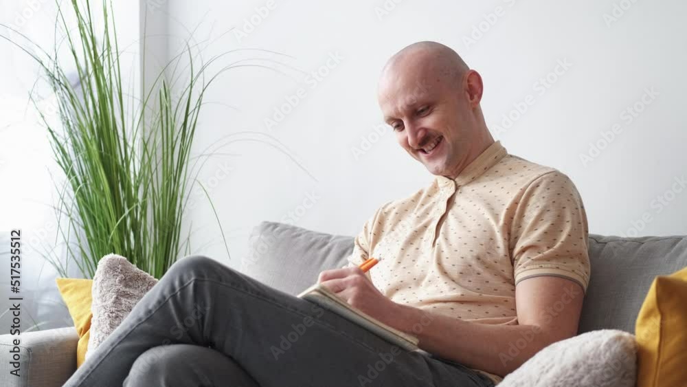 Vidéo Stock Happy planning. Inspired man. Pleasant notes. Happy guy ...