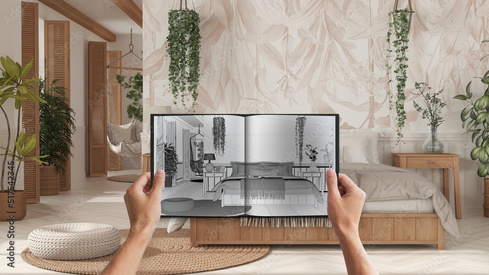 Hands holding notepad with boho style bedroom blueprint sketch or ...