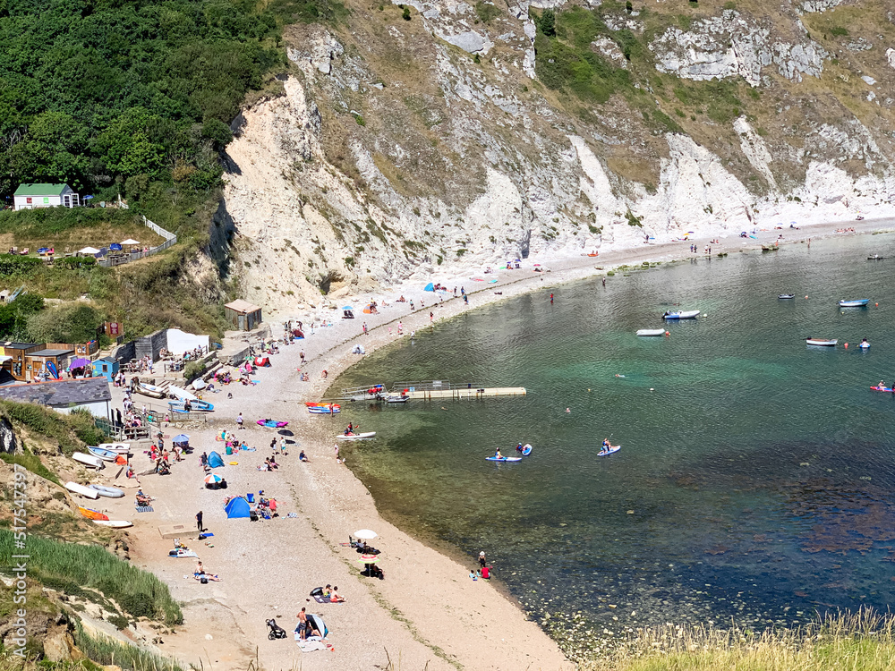 Lulworth Cove bay, beach and cliffs view . The Jurassic Coast is a ...