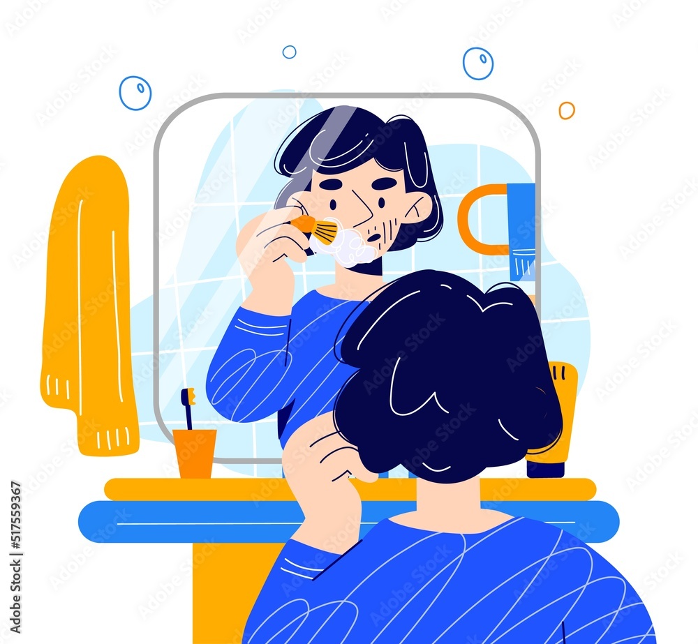 Man shaves in bathroom. Guy smears face with shaving foam in front of ...