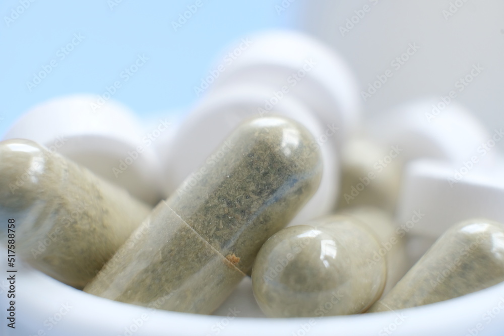 Medical tablets, capsules, and blister-packaged pills are dispersed ...