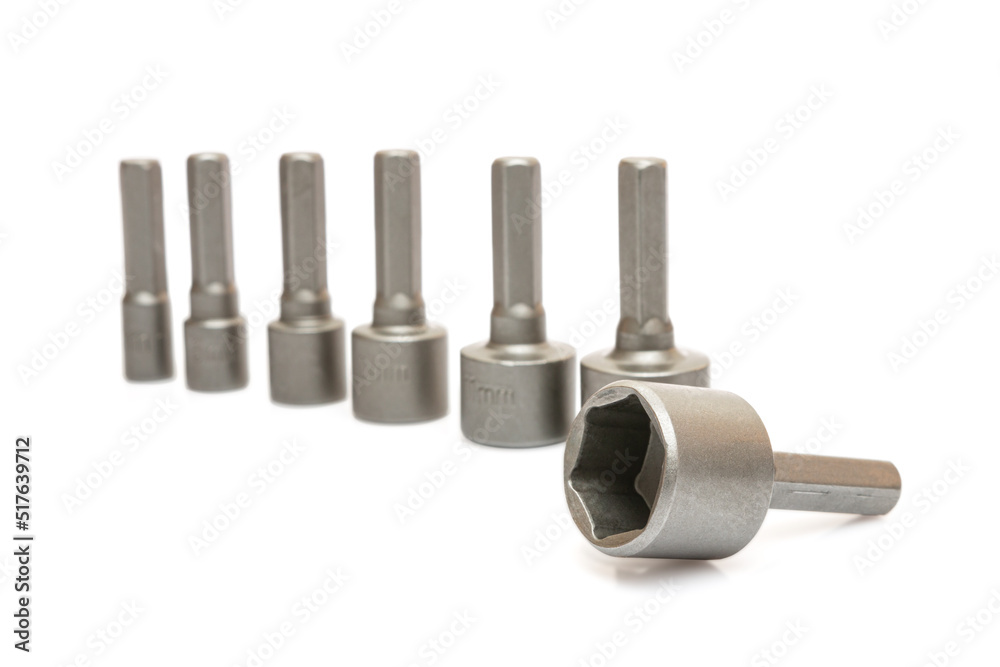 Set of interchangeable hexagonal sockets of different shapes and sizes ...