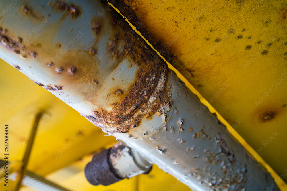 Steel pipe with blister paint, rust paint peeling off against the ...