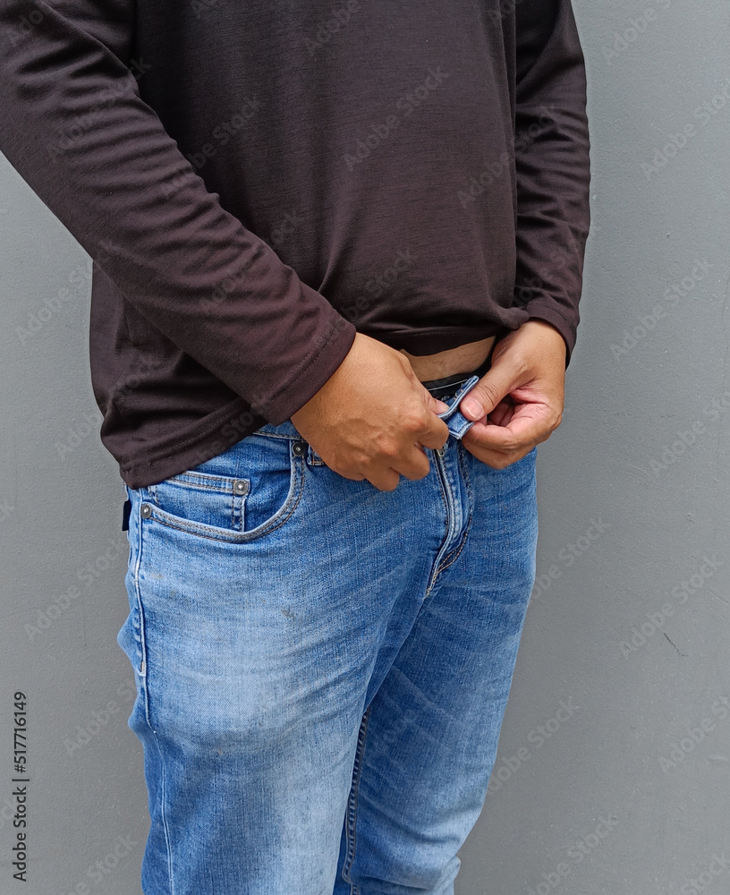 Asian man taking off his pants due to diarrhea and urinary incontinence ...