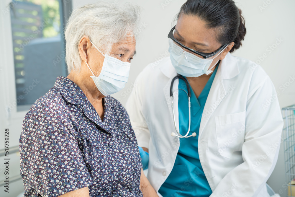 Asian doctor wearing face shield and PPE suit new normal to check ...