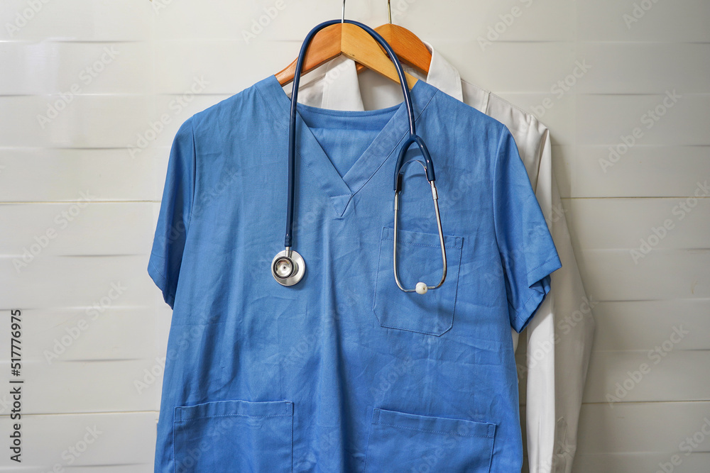 Closeup doctors scrus with stethoscope. Blue surgical smock with ...
