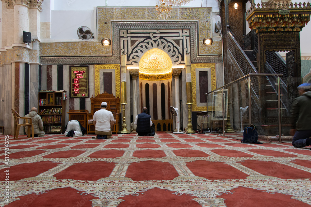 Muslim visitors praying in Abraham Mosque of Hebron. Tombs of Isaac and ...
