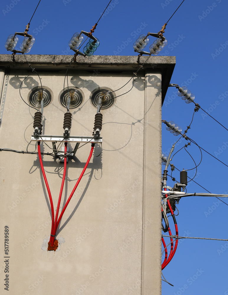 High voltage electrical cables entering the electrical substation in ...