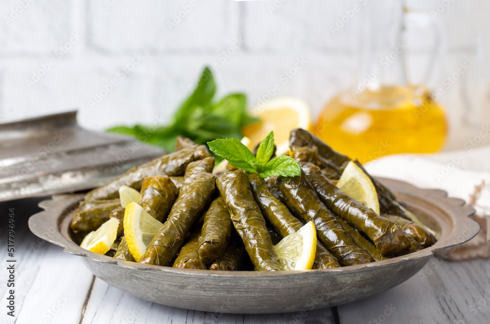 Delicious dolma (sarma) stuffed grape leaves rice, white yogurt sauce ...
