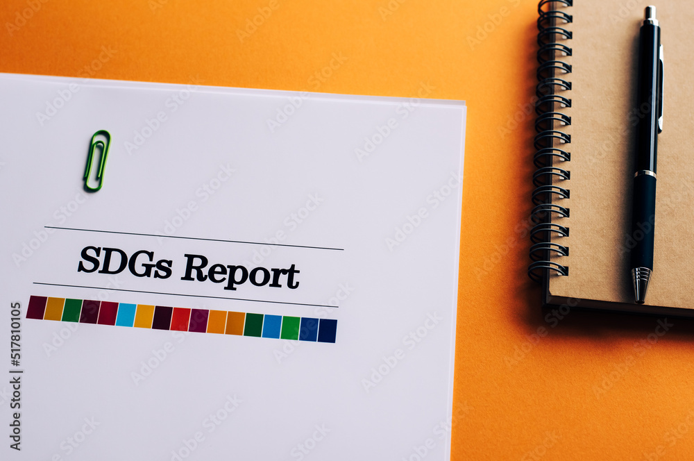 There is a dummy document of SDGs Report on the desk. Stock Photo ...