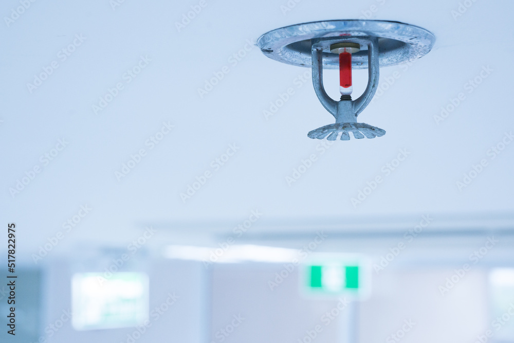 Fire fighting equipment, sprinkler on white ceiling background ...