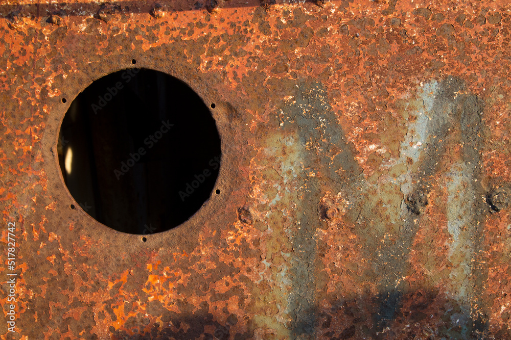 Natural rusty metal texture or background with a round hole and another ...