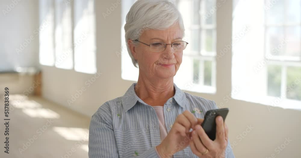 Senior woman struggling to use a phone. Angry old grandma getting ...