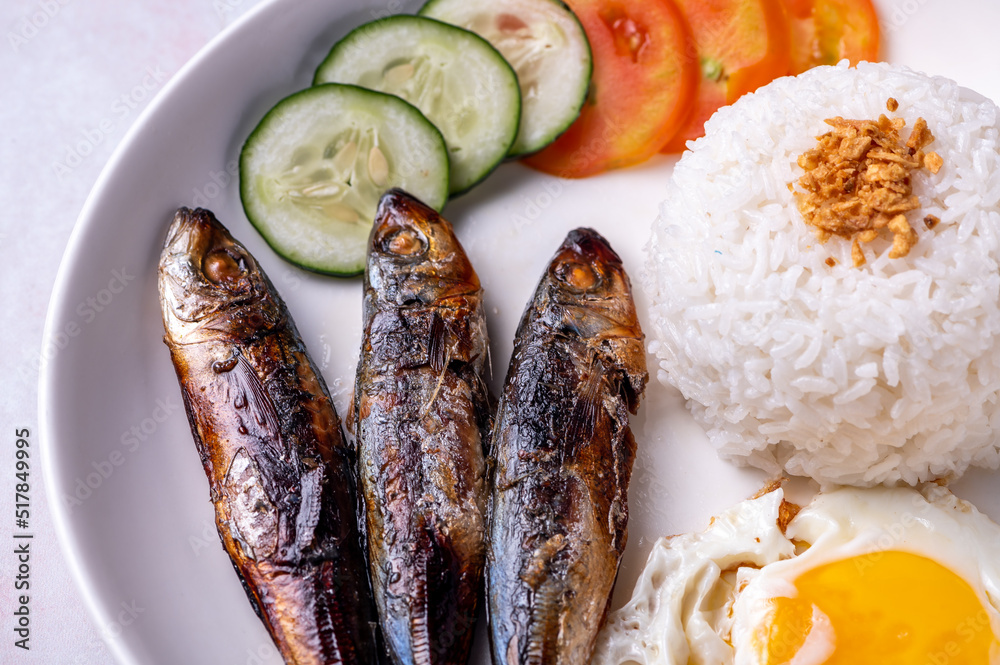 Tinapasilog is Tinapa (Smoked Fish), Sinangag (Fried Rice) and Itlog (Egg). Tinapa is a FIlipino ...