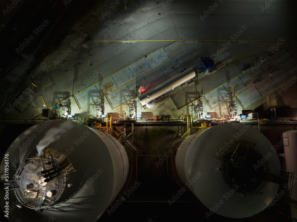 A high aerial view above large liquid gas tanks, at a facility, at ...