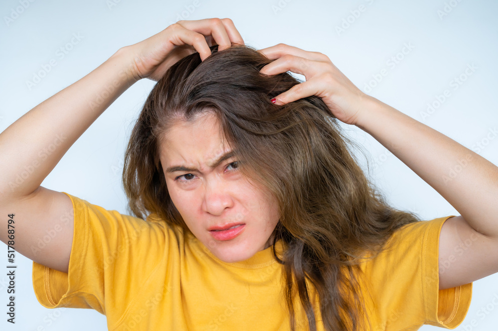 Asian woman scratching her scalp caused of itchy scalp. Dandruff and an ...