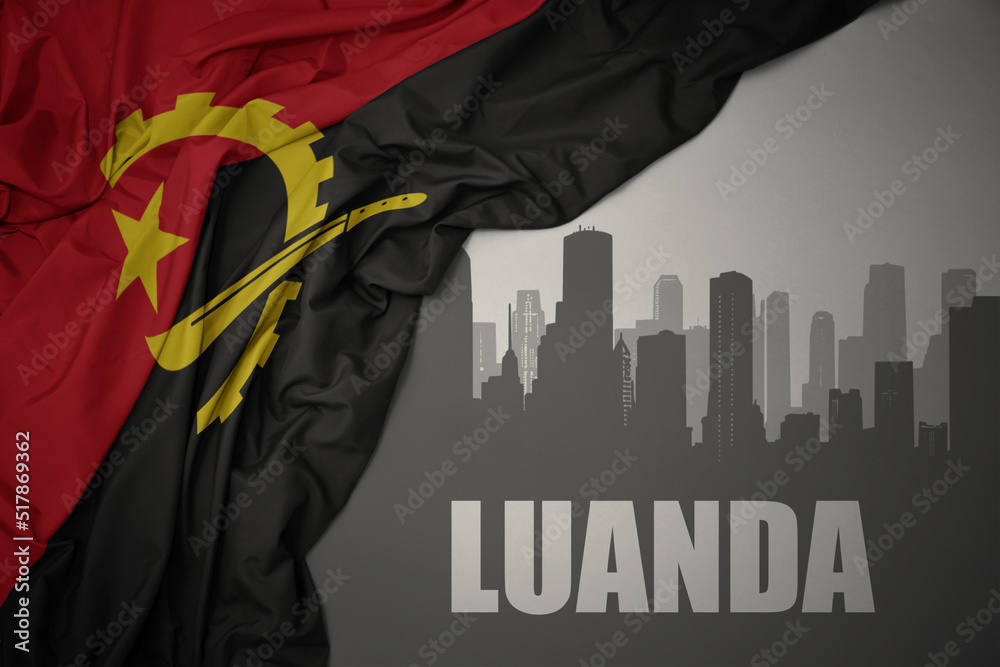 abstract silhouette of the city with text Luanda near waving colorful ...