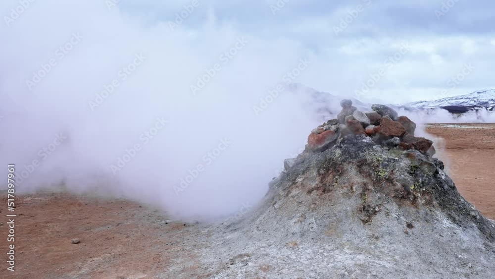 Steam emitting from fumarole in geothermal area of Hverir. Sulphur ...