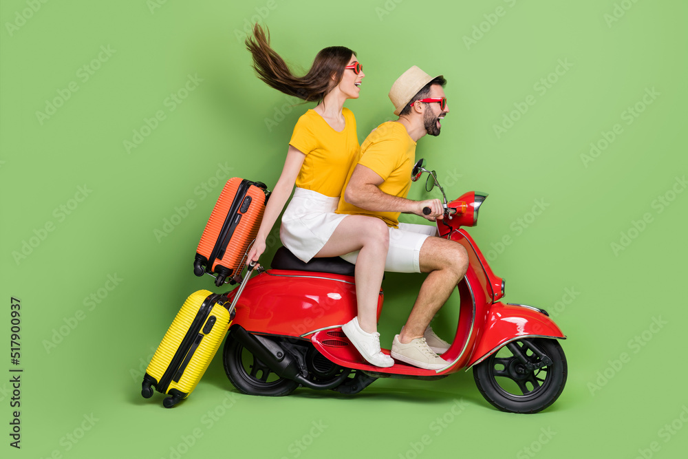 Full body profile portrait of two carefree crazy people drive moped ...