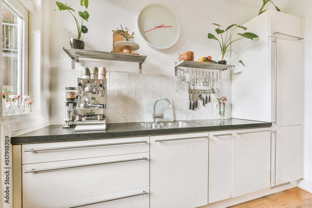 Kitchen counter with sink and cabinets Stock Photo | Adobe Stock