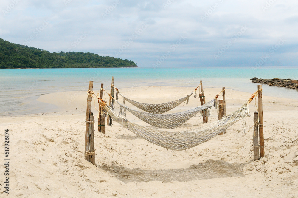 White rope cribs on the beach in Koh Kood, Thailand Stock Photo | Adobe ...