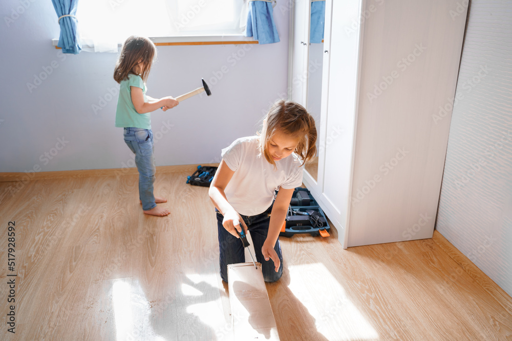 Dad,little girls daughters assemblle wooden baby bed according to ...