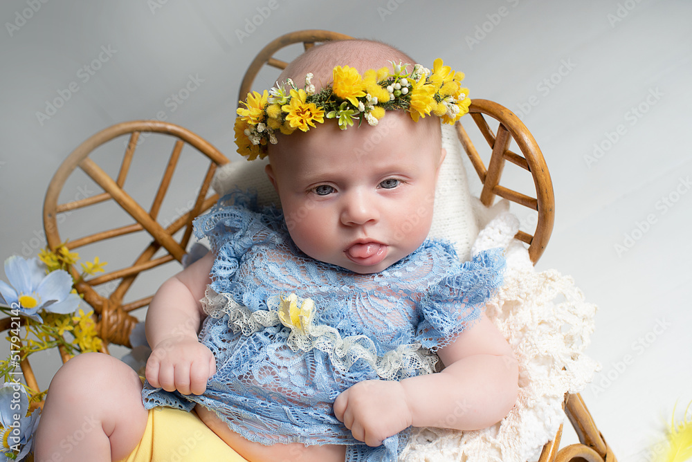 Ukrainian newborn baby girl dressed in elegant clothes in the colors of ...
