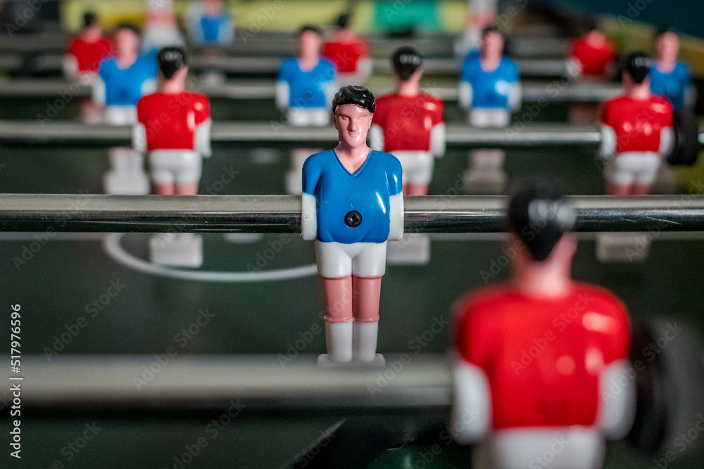 Figures of football players in the board game. Team work. Table ...