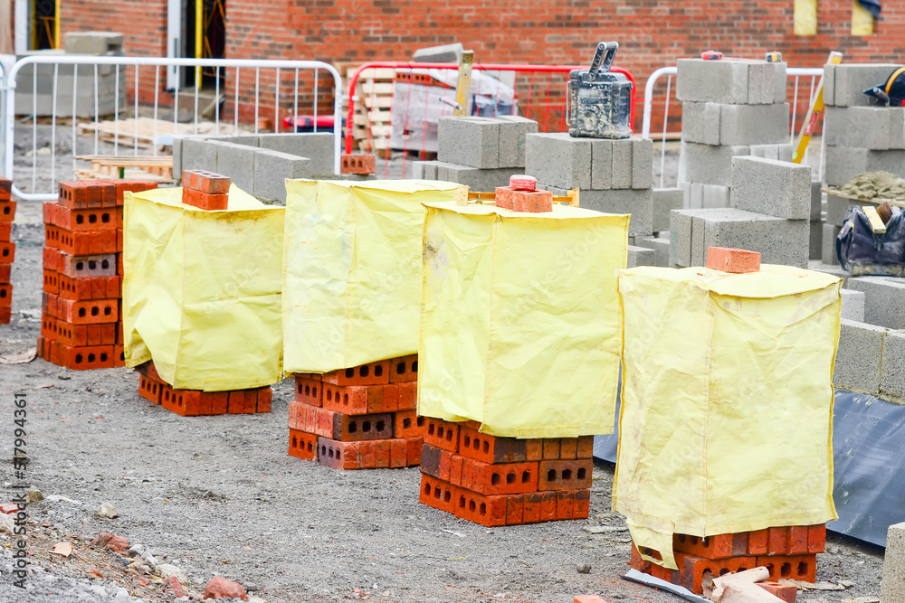 Red bricks and concrete blocks delivered on construction site and ...