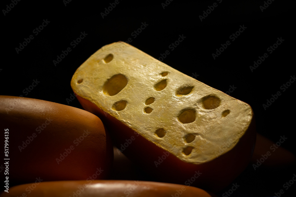 Cheese on dark background. Layout of cheese is made of plastic. Food on ...
