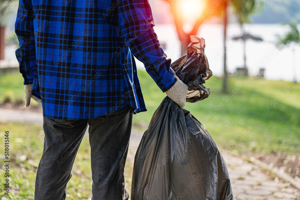 volunteers collect plastic bottles in garbage bags ecology natural ...