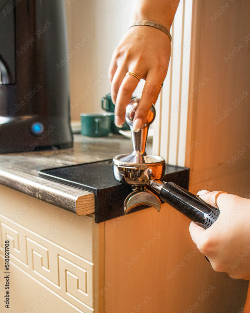 extraction of freshly ground, coffee from a professional coffee machine ...