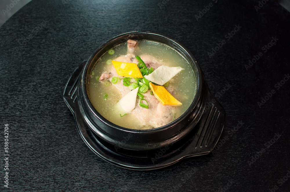 Korean Samgye Tang, Ginseng chicken soup, a whole young chicken filled ...