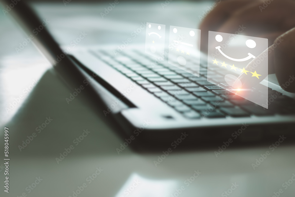Businessman use laptop pressing smiley face emoticon on virtual touch ...