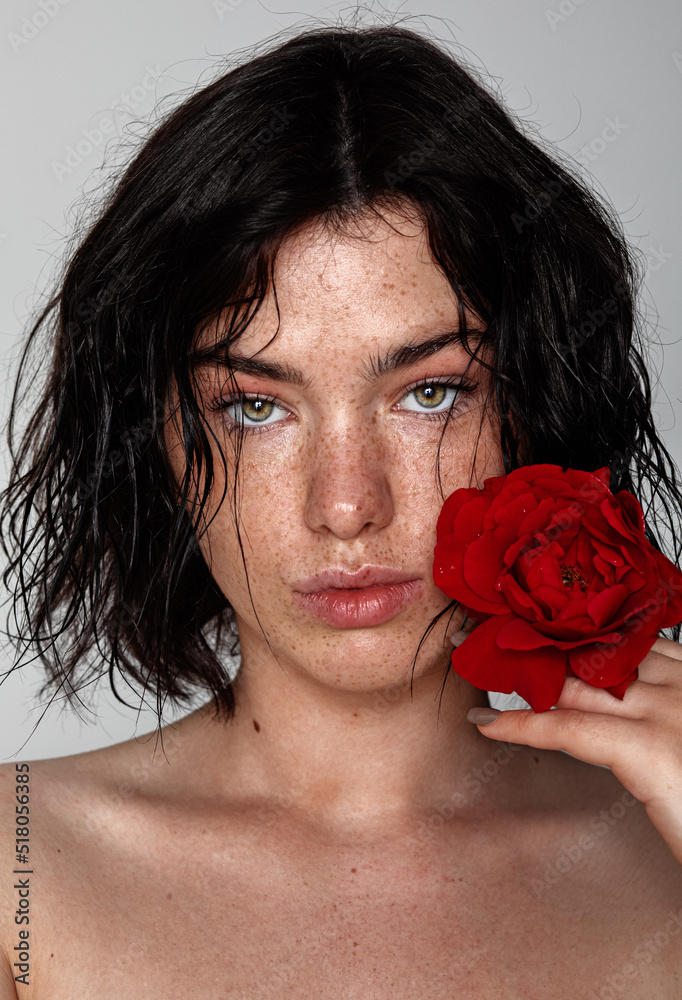 beauty young woman face with a lot of freckles and natural lips, red ...