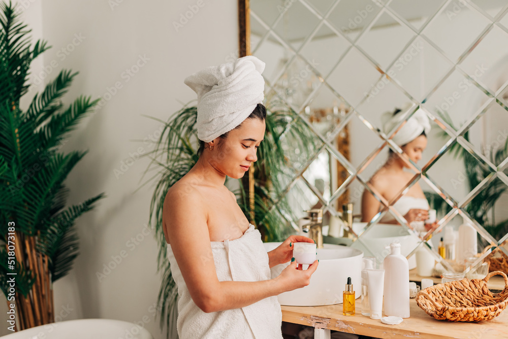 Facial Skincare. Happy Korean asian woman applying Facial serum using ...