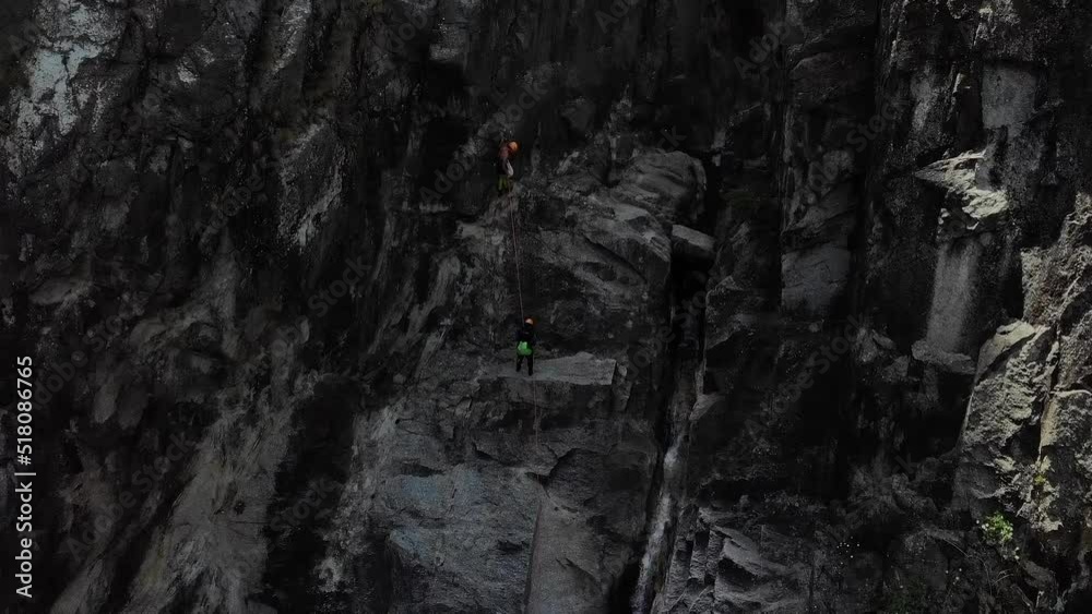 Drone view of people abseiling and canyoning. Aerial view of abseiling ...